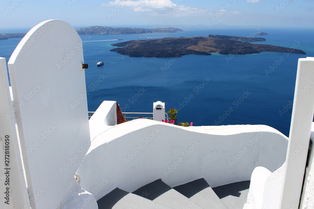 Santorini oia fira caldera view. White walls and stairs. Narrow street ...