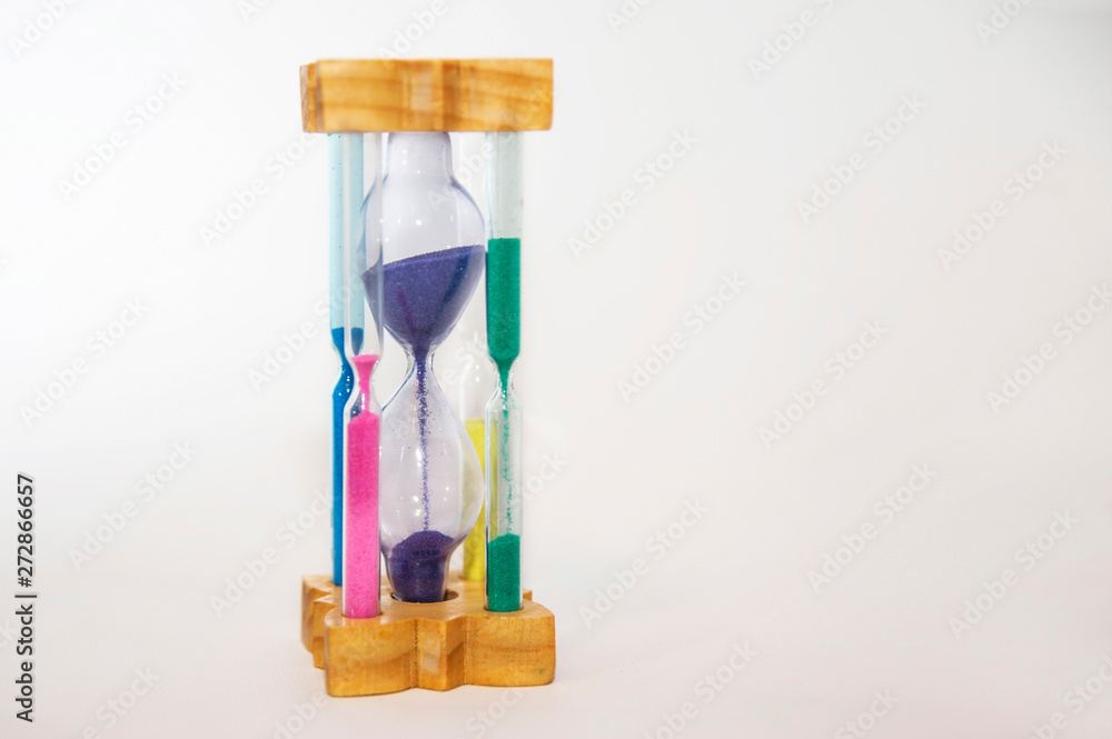 An ancient clock with colored sand shows the countdown time, as time ...