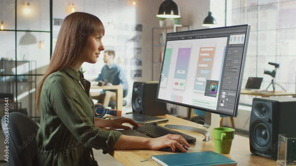 Beautiful Brunette Female Designer Works with Mobile App Interface on ...