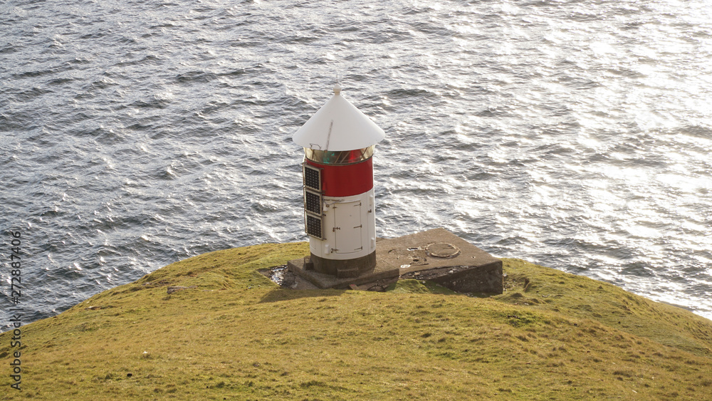 Lighthouse at the Drangarnir Hike near Sørvágur on the Faroe Islands in ...