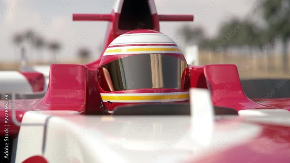 Video Stock Close-up of a formula one race car driver driving along the ...