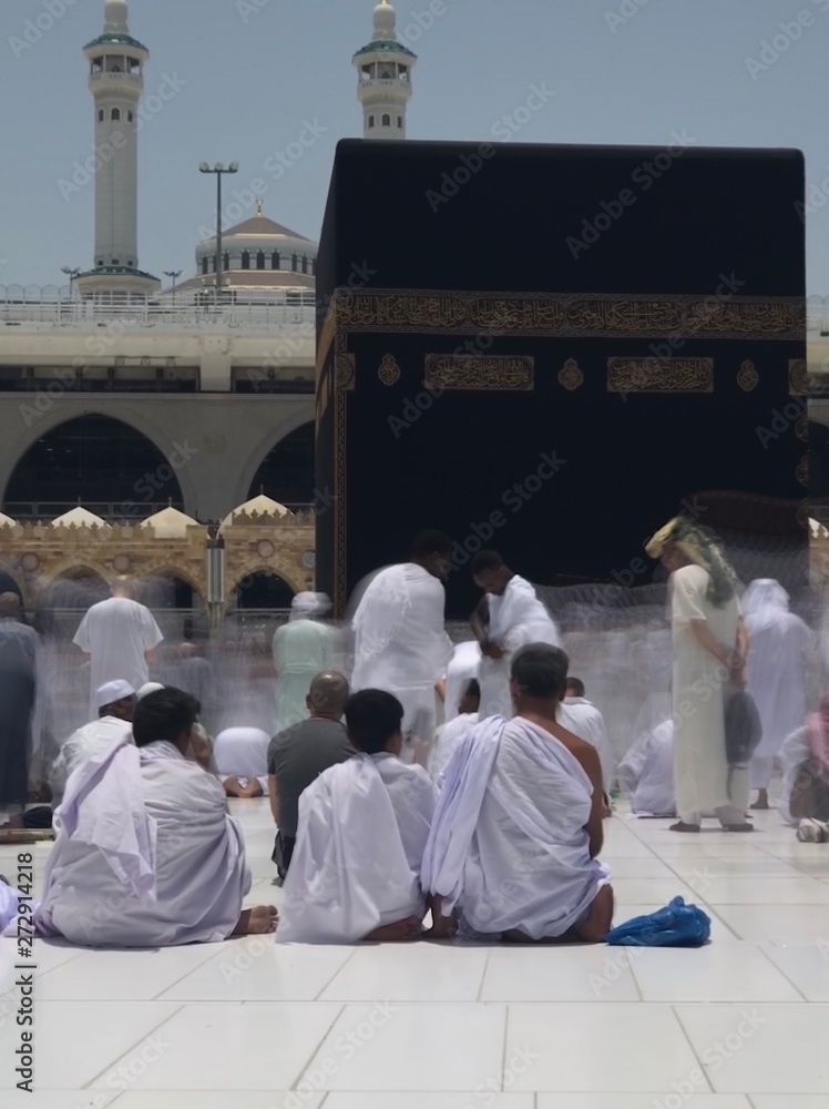 Motion blur of Muslim pilgrims circumambulate the Kaaba counter ...