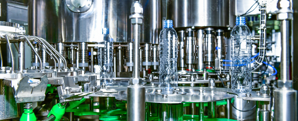 Clear plastic Bottles transfer on Automated conveyor systems industrial ...