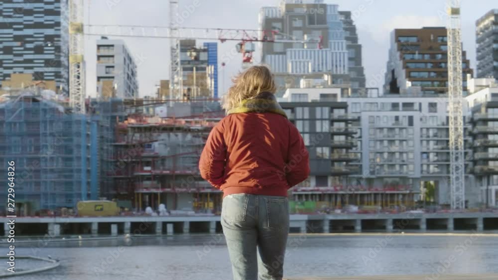 4K anamorphic video with pan motion of a young Norwegian woman with ...