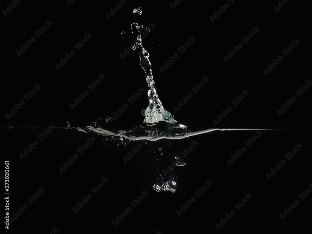 Water splash, bubbles and rippling surface isolated on black background ...