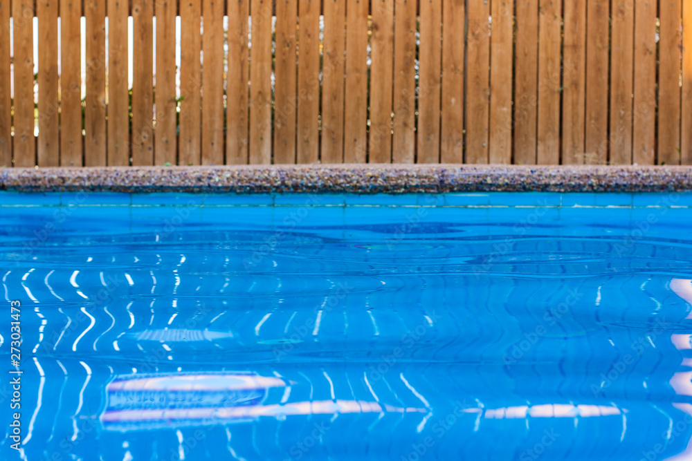 pool smooth water slightly wavy surface and horizontal board with ...