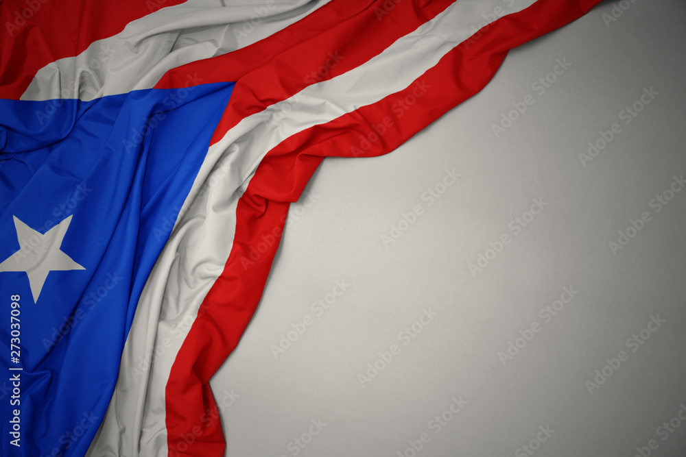 waving national flag of puerto rico on a gray background. Stock Photo ...