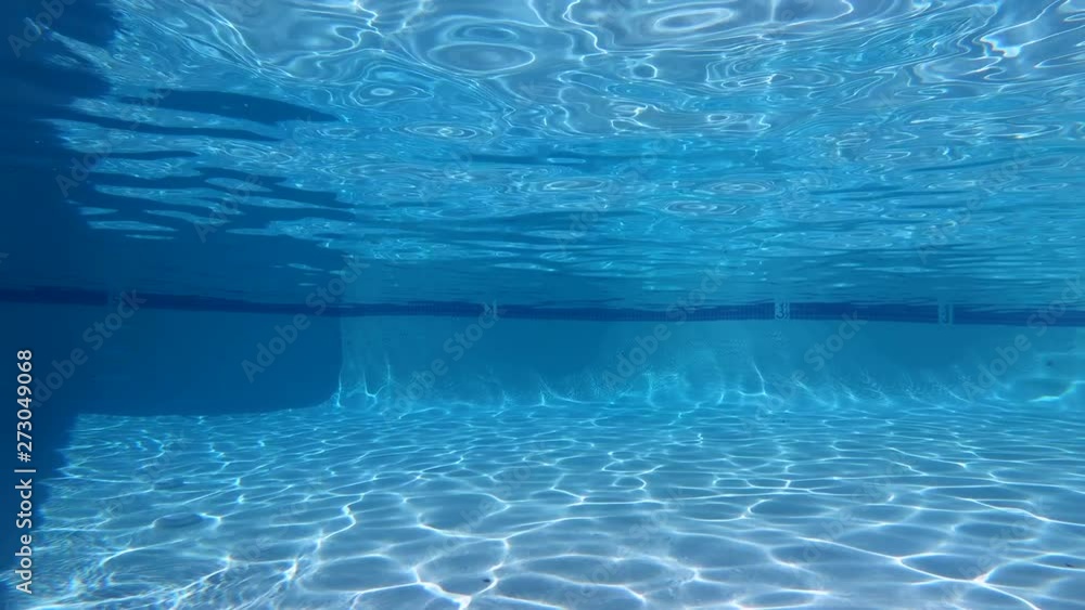Empty underwater swimming pool with moving sunlight patterns. Stock ...