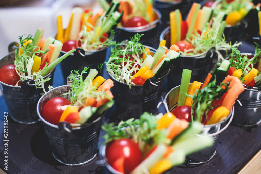 Beautifully decorated catering banquet table with variety of vegetables ...
