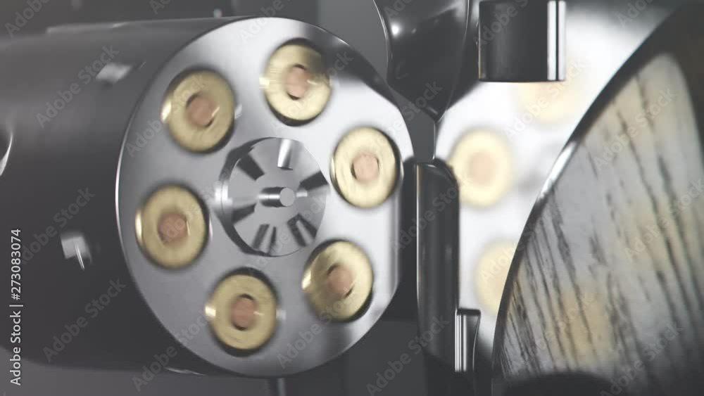Revolver spinning cylinder holding six cartridges. Close up. Ready to ...