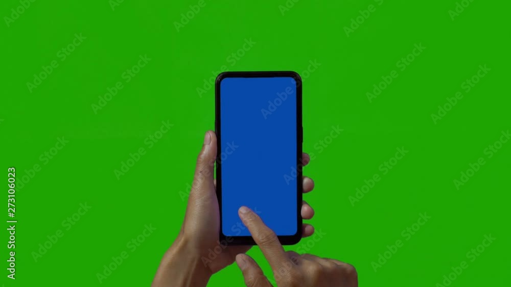 Phone in the hand close up isolated at green background. Phone screen ...