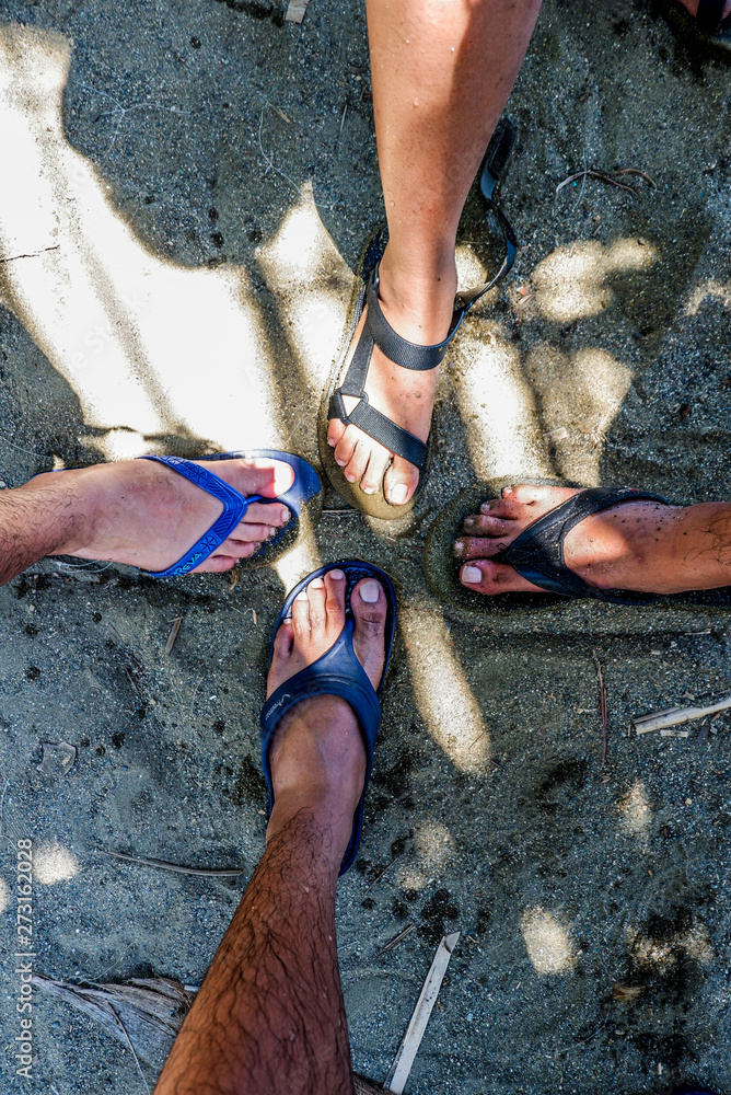 feet of island hoppers in slippers Stock Photo | Adobe Stock