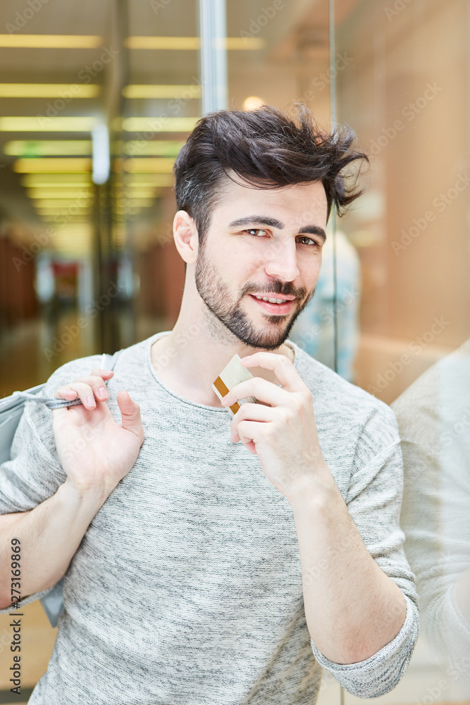 Young man as a customer and consumer Stock Photo | Adobe Stock