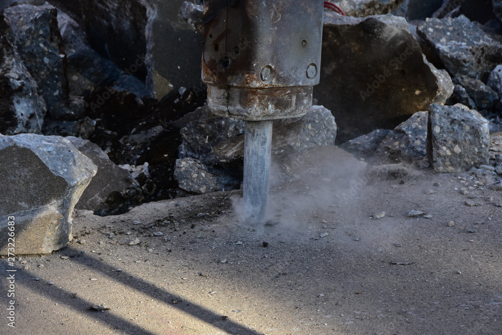 Backhoe with jackhammer tool breaking up concrete driveway. Stock Photo ...