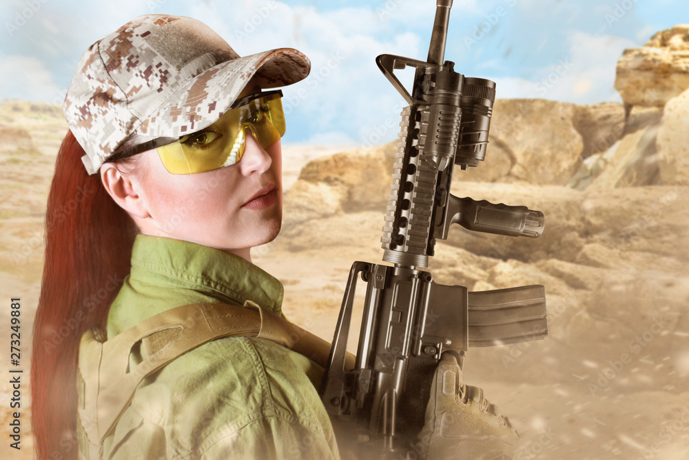 Portrait of young and beautiful military soldier woman with red hair ...