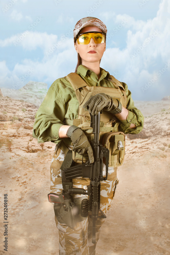 Beautiful fully equipped military soldier woman in protective armor ...