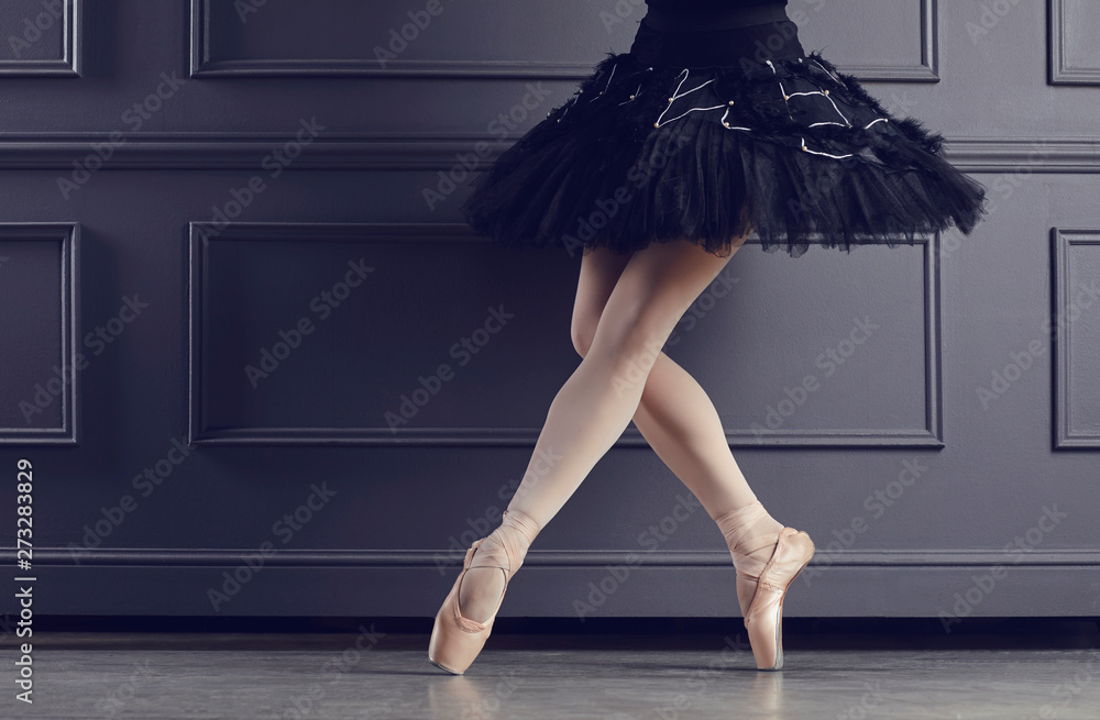 Legs of a ballerina on a black background. Stock Photo | Adobe Stock