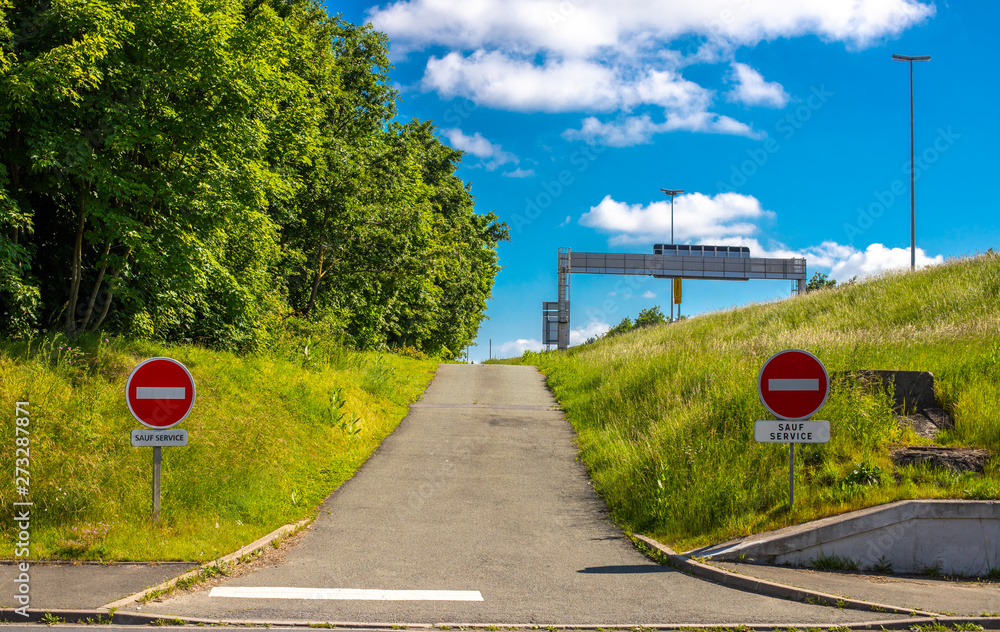 Road sign do not enter. There is no entry to that side. The road goes ...