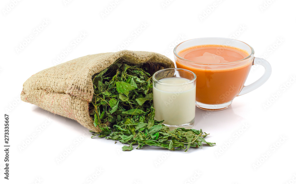 Cup of hot thai tea with milk , thai tea leaf in sack isolated on white ...