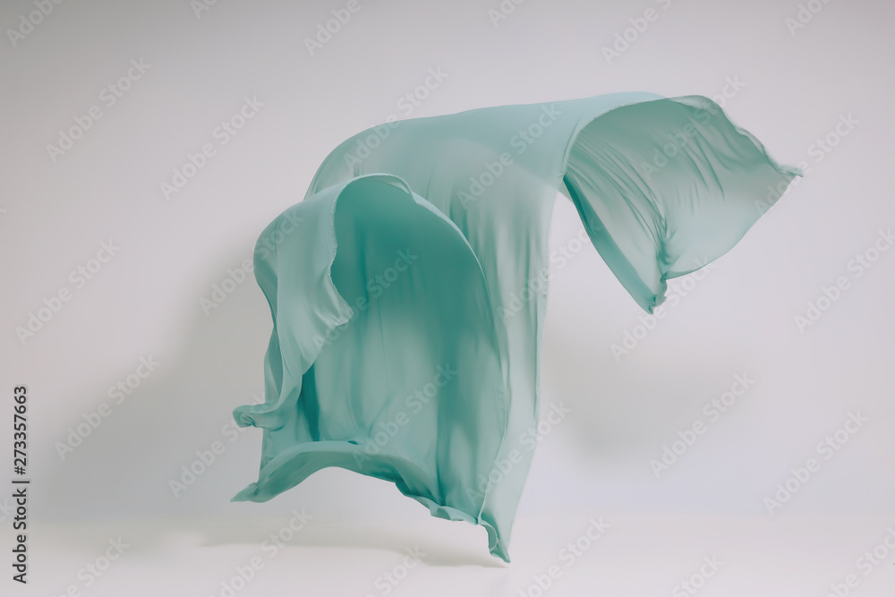 Turquoise fabric on a white background. Levitate Turquoise fabric in ...