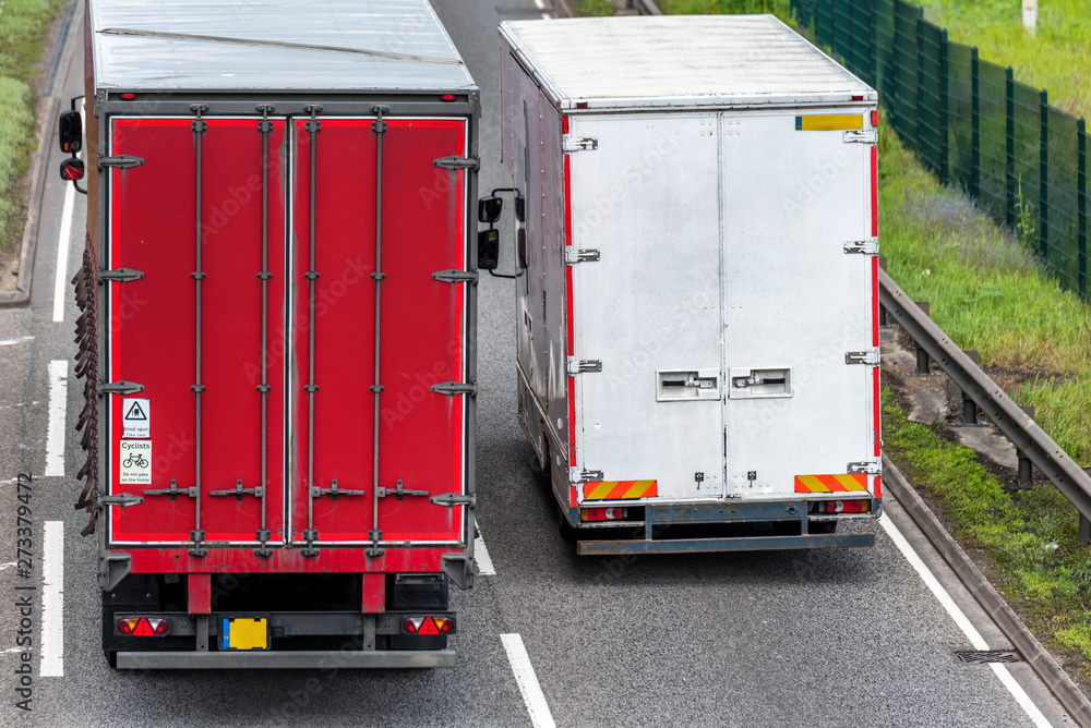 two box lorry trucks on uk motorway in fast motion Stock Photo | Adobe ...