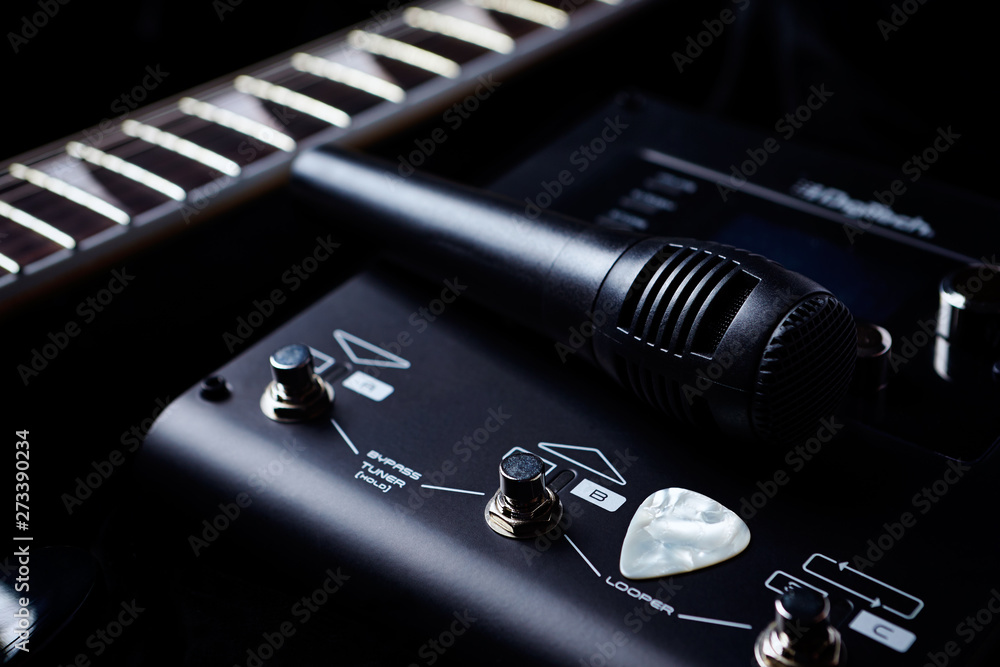 Multieffects Processor for Electric Guitar and a Microphone on black ...