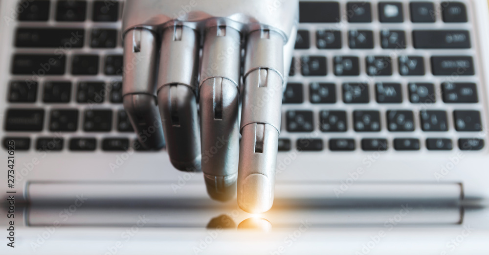 Robot hands and fingers point to laptop button advisor chatbot robotic ...