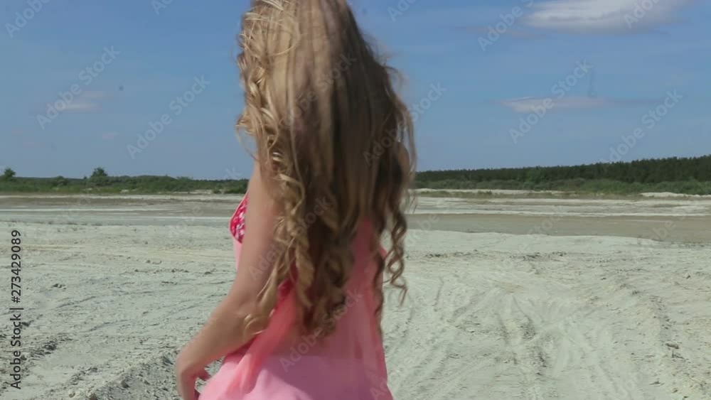 Girl with perfect figure in swimsuit on the beach Stock Video | Adobe Stock