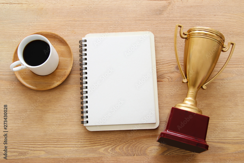 Open notebook with empty pages over wooden old office desk table. Top ...