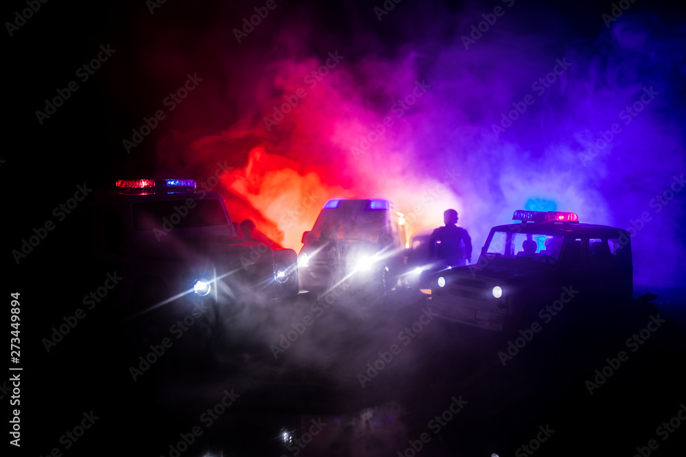Police cars at night. Police car chasing a car at night with fog ...
