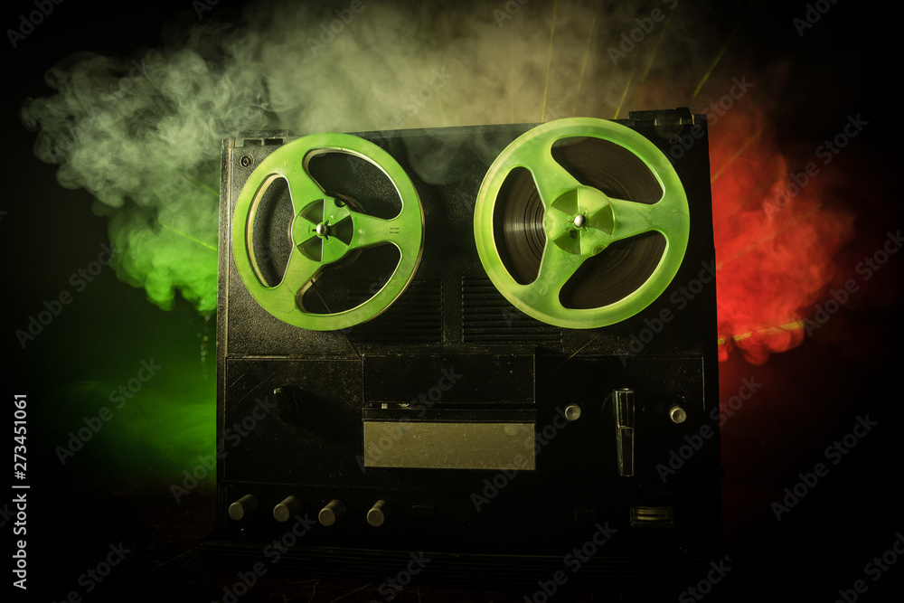 Old vintage reel to reel player and recorder on dark toned foggy ...