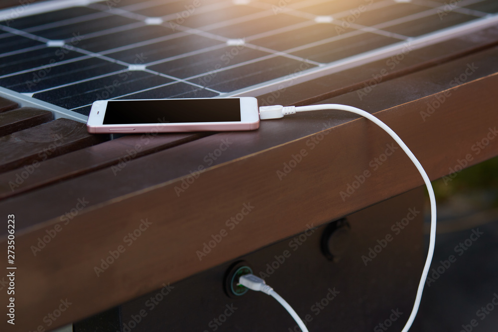 Stockfoto Photo of mobile phone charging via USB from solar power on ...