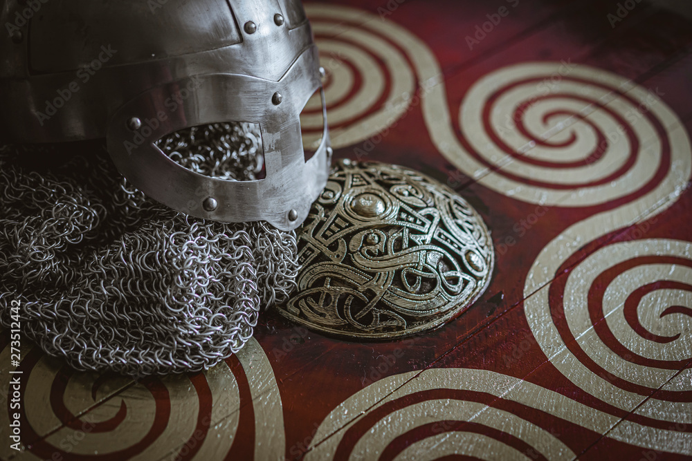 Triskel, Vikings, viking helmet with chain mail on a red shield with ...