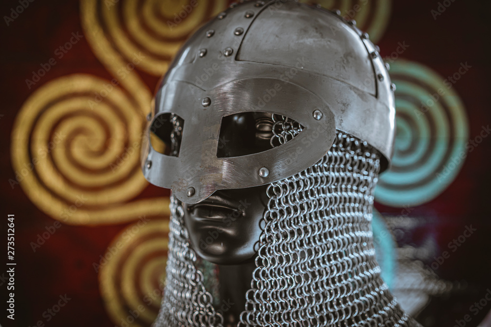 Costume Vikings, viking helmet with chain mail on a red shield with ...