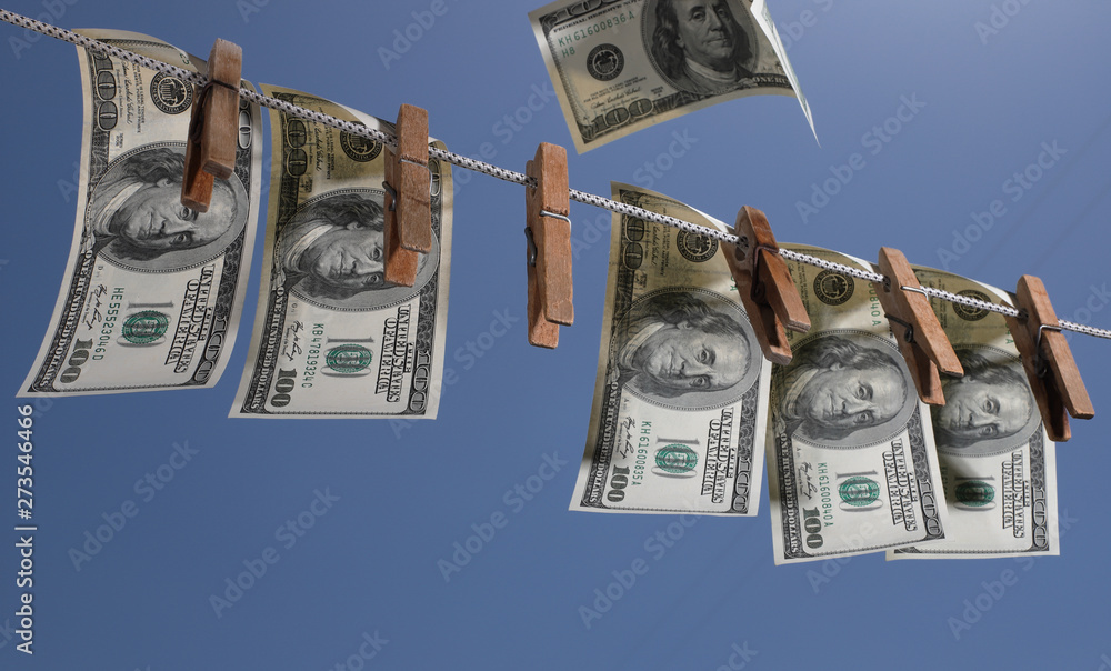 Foto de Money Hanging On a Clothesline With Old Wooden Clothespin. The ...