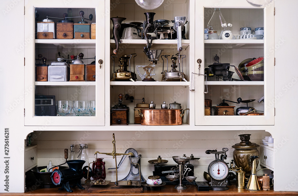 Old fashioned items on wooden shelf. Colorful of ancient collection in ...