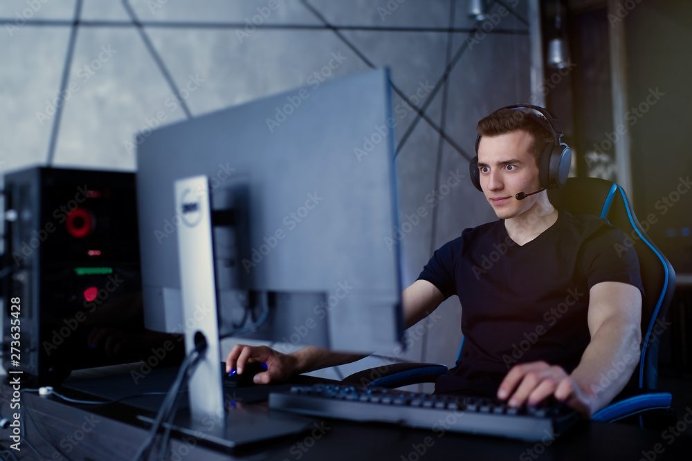 Professional gamer in his expensive studio young man having live stream ...