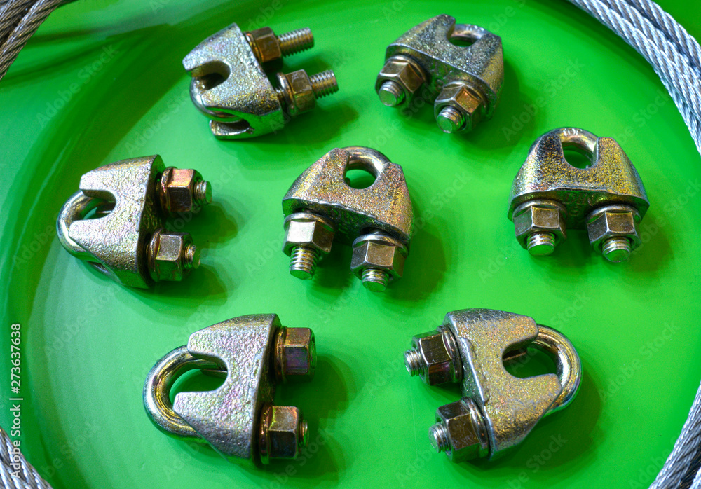 Clamps for cables and a steel cable placed on a stand Stock Photo ...