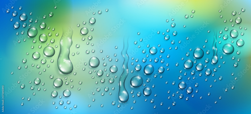 Water rain drops or condensation over blurred green nature background beyond the window ...