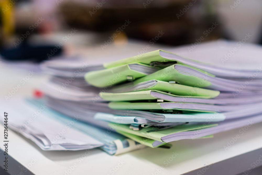 Stacks of piles unfinished papers documents files in accounting ...