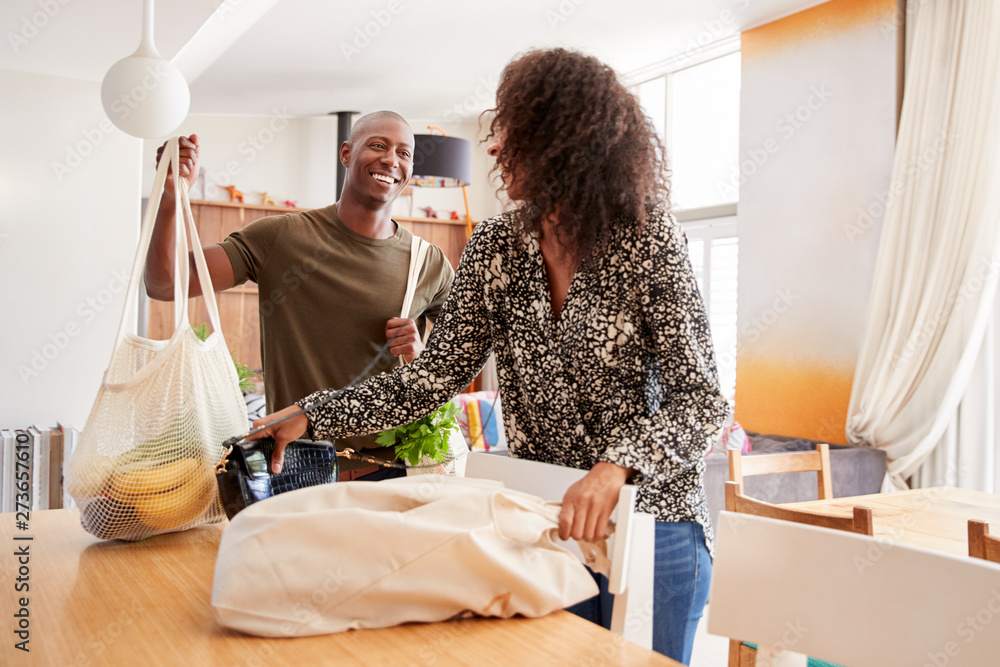 Couple Returning Home From Shopping Trip Unpacking Plastic Free Grocery ...