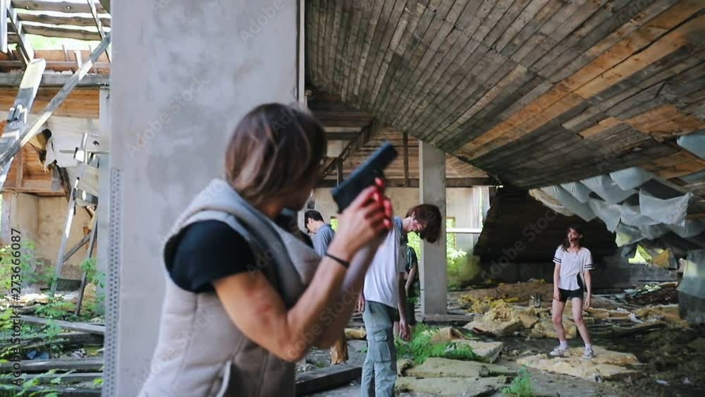 A zombie attack on the top floor of abandoned building. Survived woman ...
