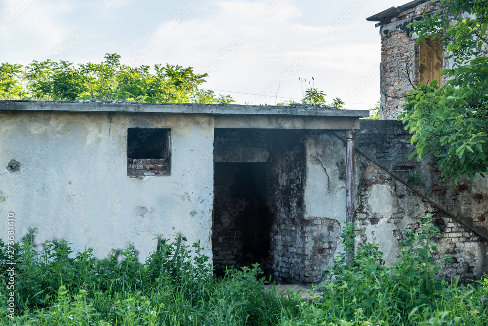 Old abandoned demolished house used like shelter for homeless people ...