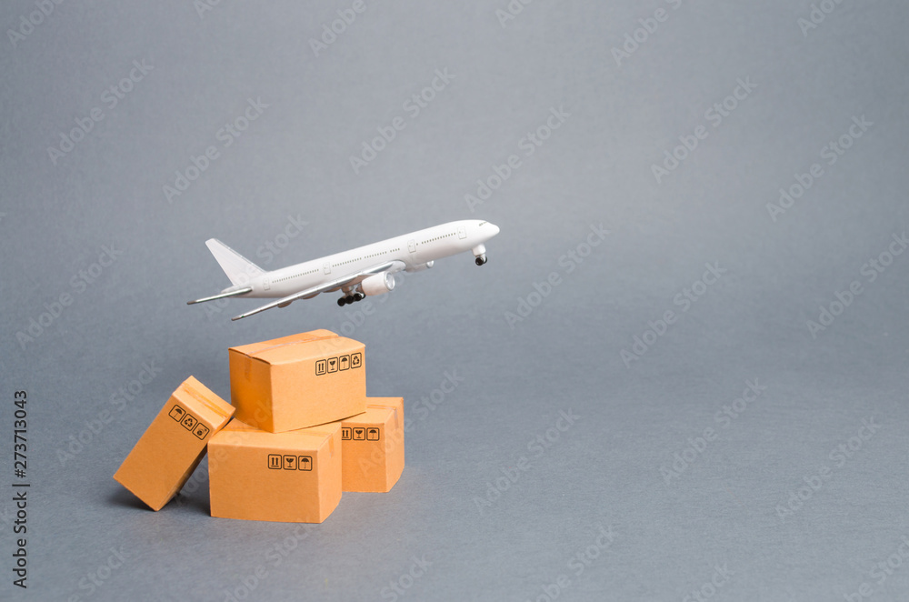 Airplane and stack of cardboard boxes. concept of air cargo and parcels ...