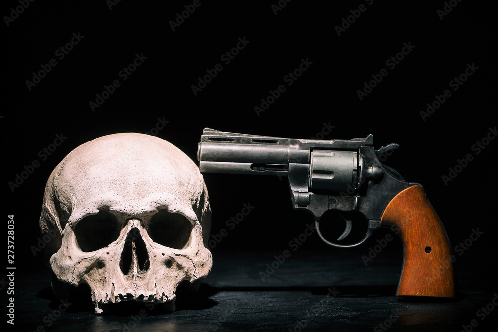 Mafia, justice and murderment crime concept. Human skull with revolver ...