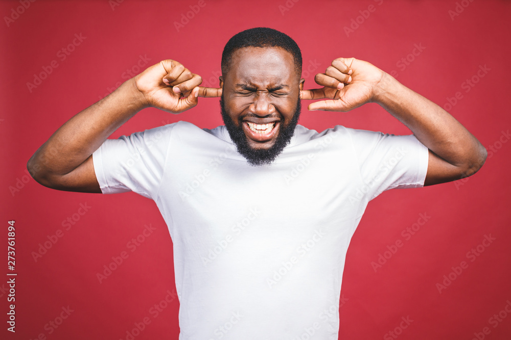 Closeup portrait of a young angry unhappy stressed man covering his ...