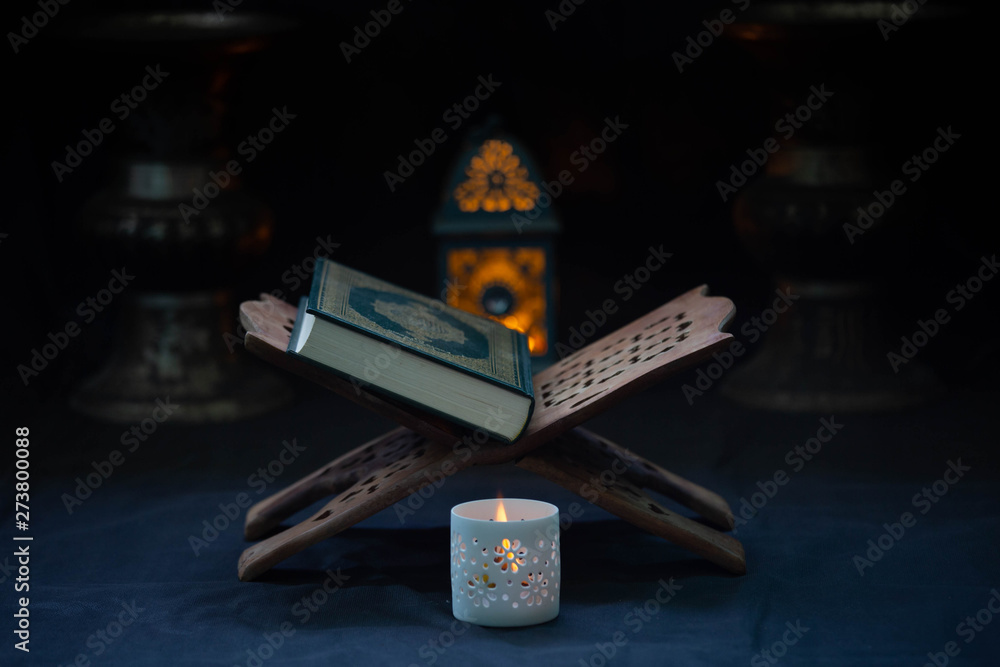 Quran in the mosque - open for prayers The black background of the ...