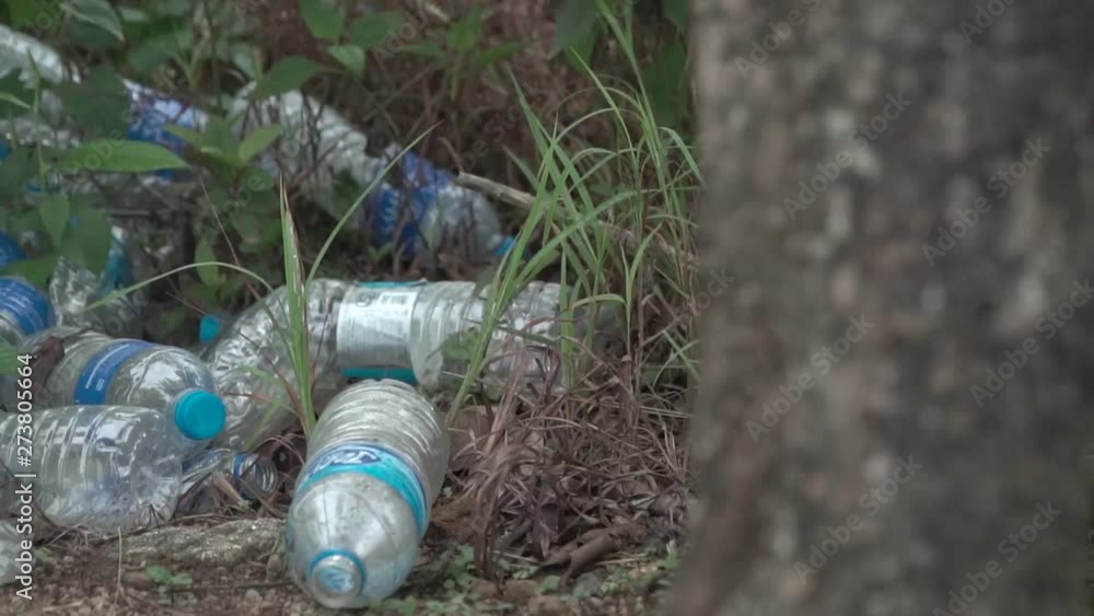 plastic water bottle floating on water river causing water pollution ...