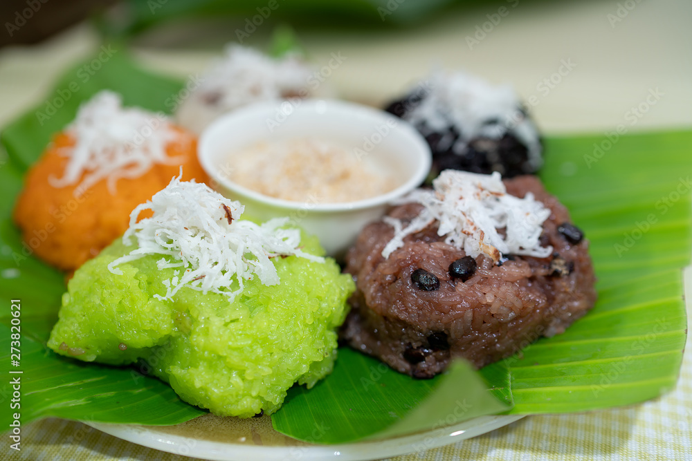 Colorful of sticky rice or Xoi on banana leaf with sesame salt. Famous ...