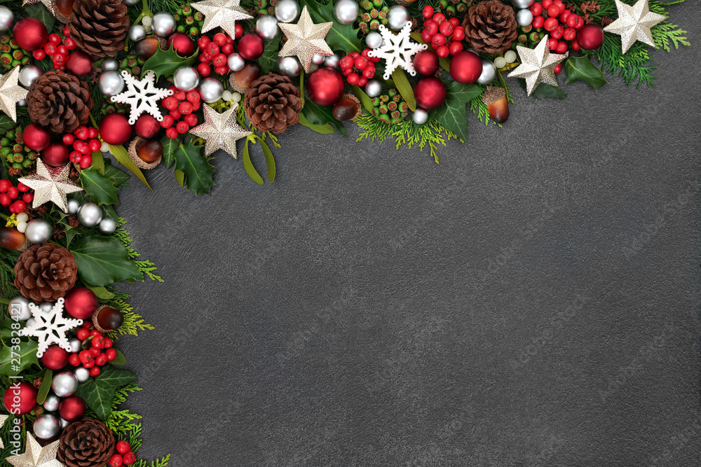 Festive Christmas background border with star and ball baubles, holly ...